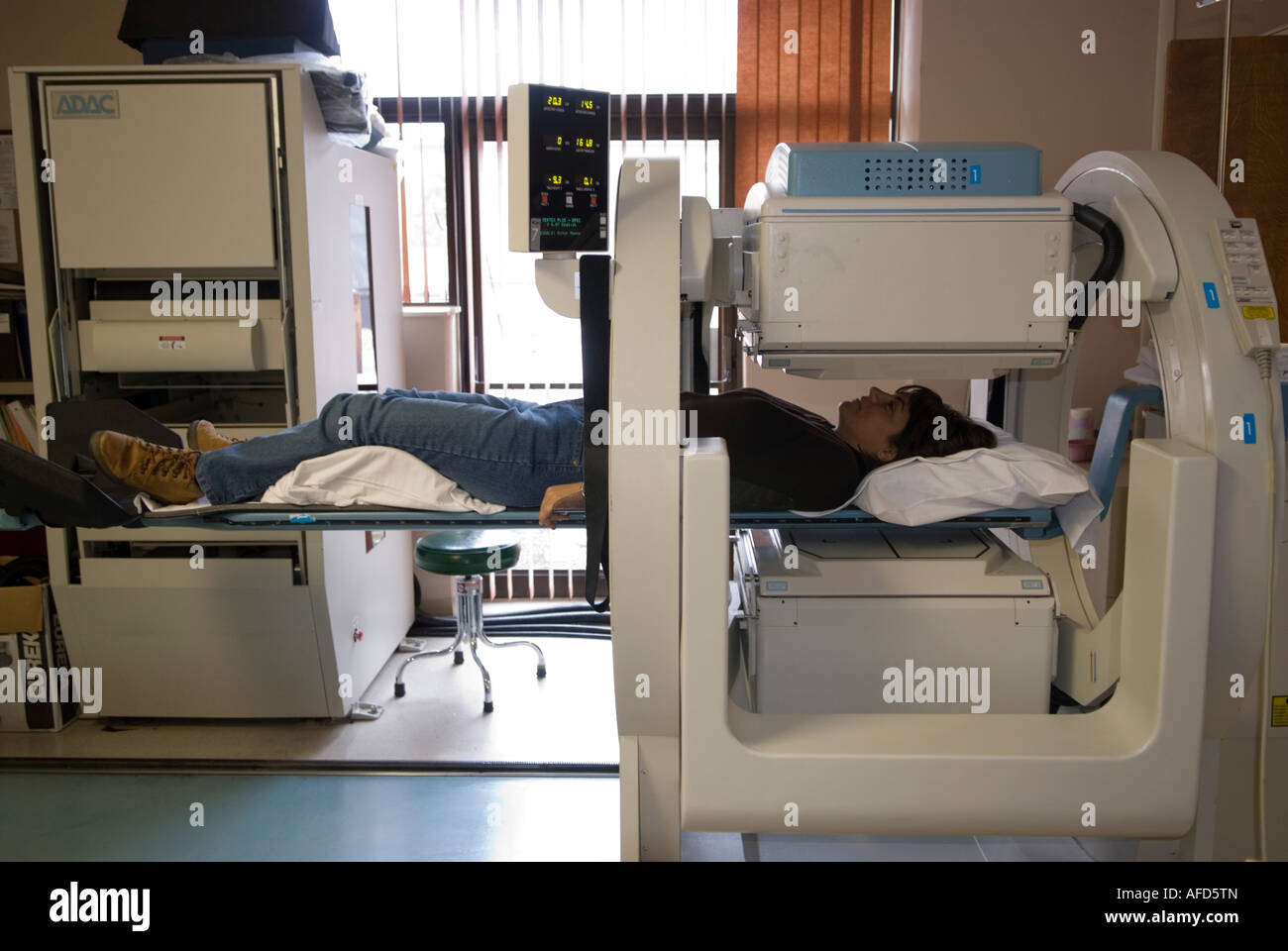 Woman undergoing Radionucleide Cisternography using Gamma Camera Stock ...