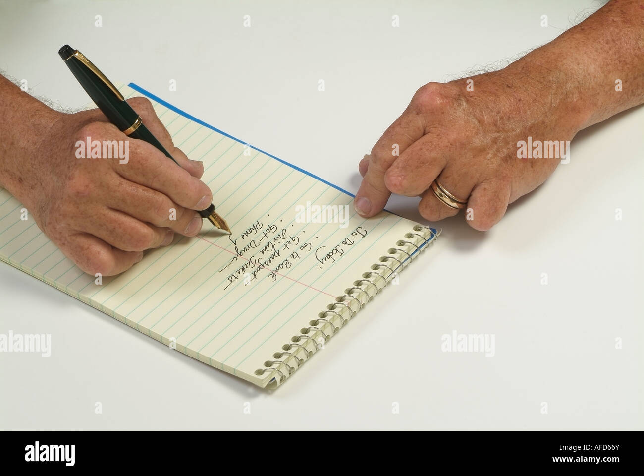 The Hands of a 65 year old man with Rheumatoid Arthritis while writing ...