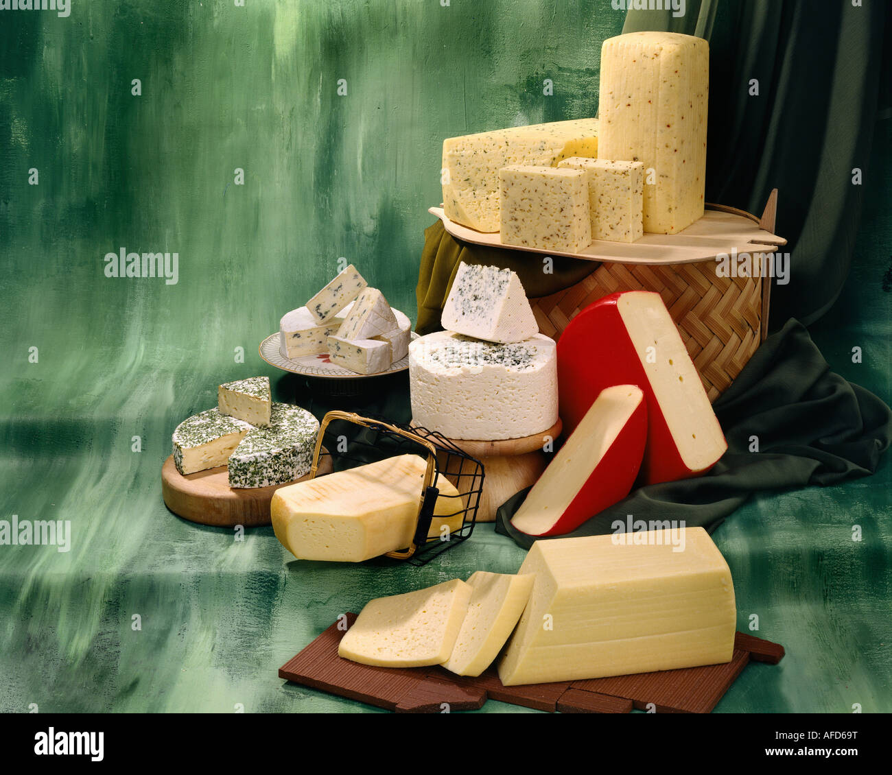 Danish Cheeses in group color photograph on green toned mottled ...