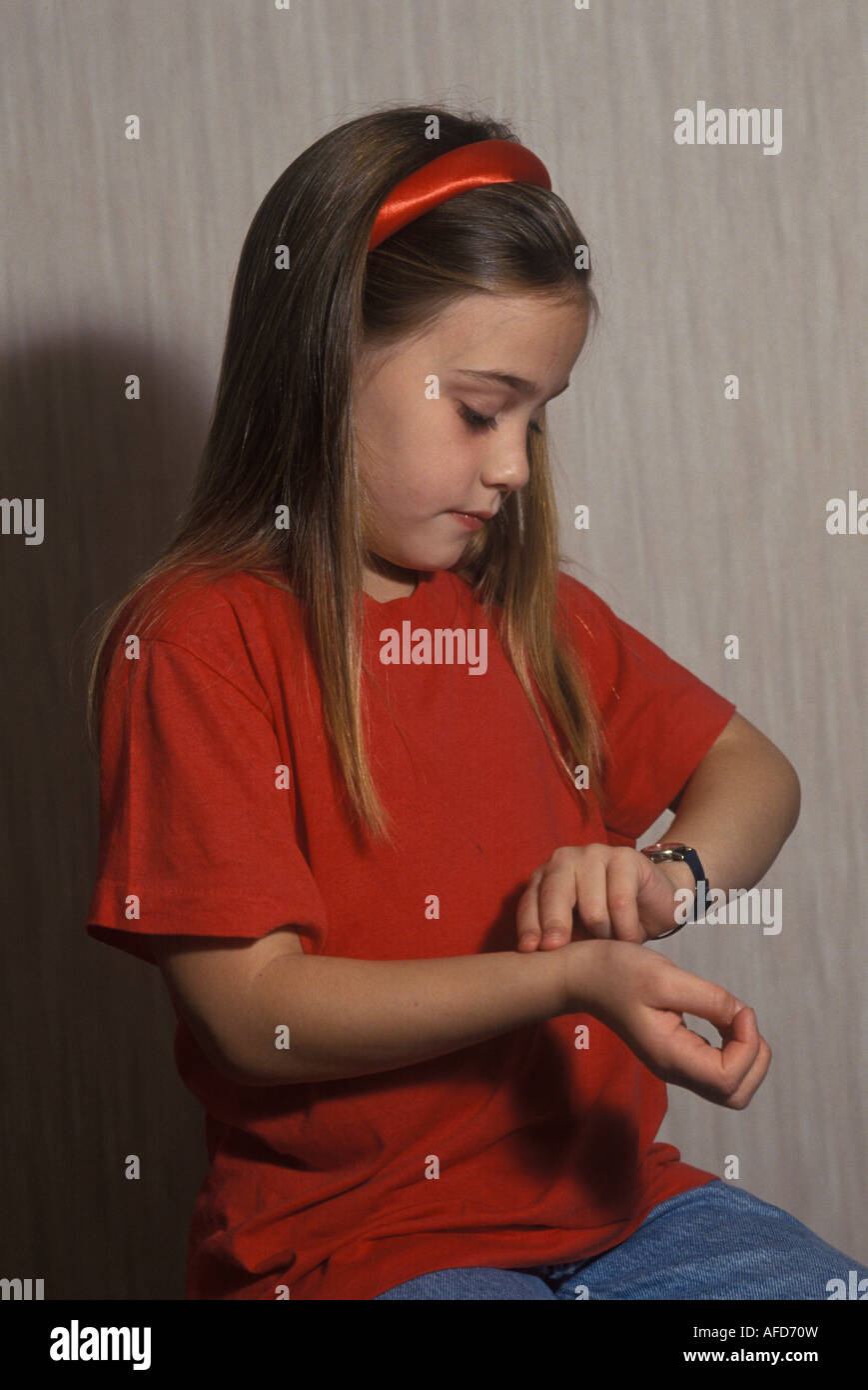 young girl taking her pulse Stock Photo - Alamy