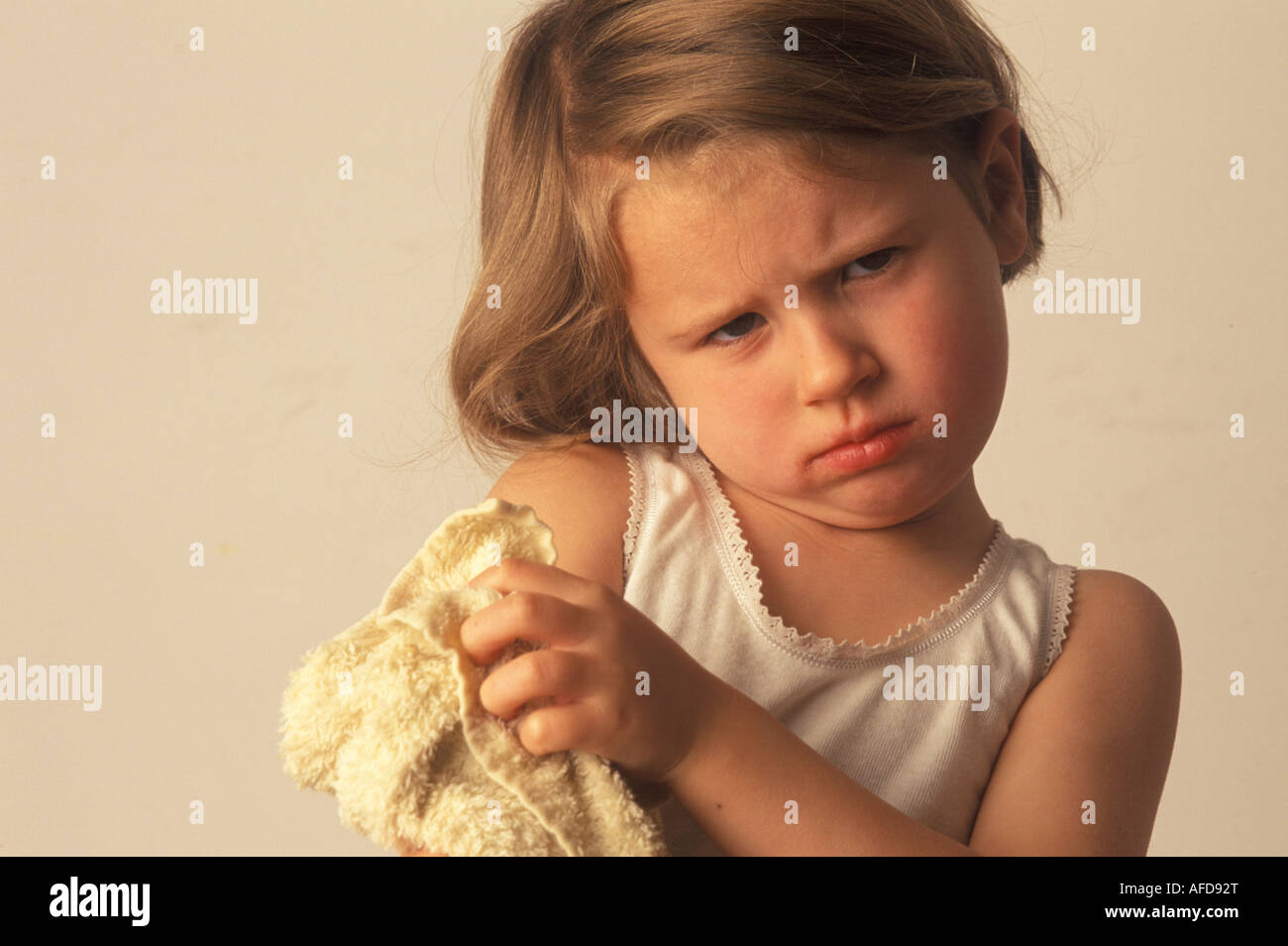 child rubbing her face with a flannel Stock Photo - Alamy