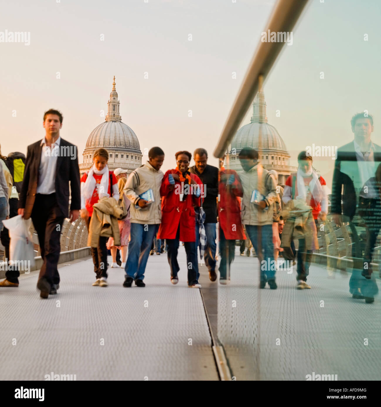 Crossing millennium bridge away from St Pauls towards bankside London ...