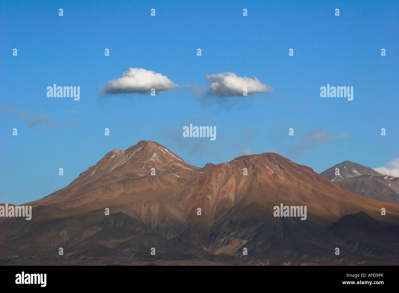 Clouds over volcanoes Stock Photo - Alamy
