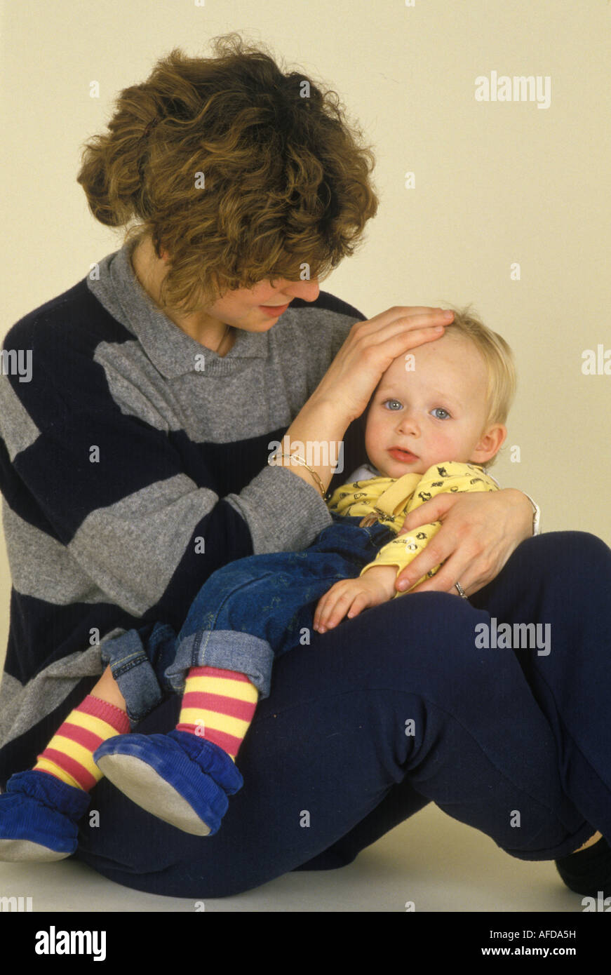 mother soothing child Stock Photo - Alamy