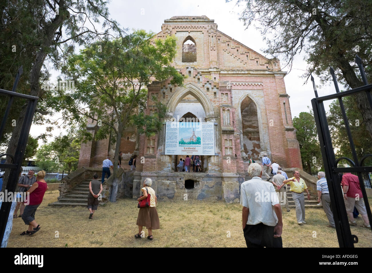 German tourists visiting the ruins of the church in the former ...