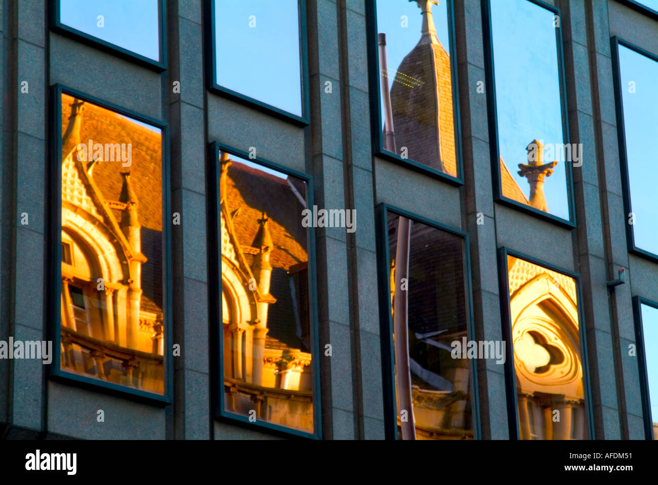 reflections in mirrored business office windows Stock Photo - Alamy