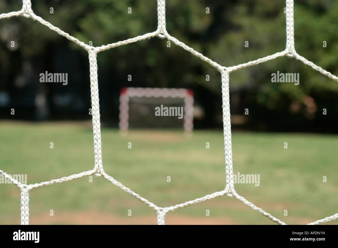 Football net framing the goal of the opposition Stock Photo - Alamy