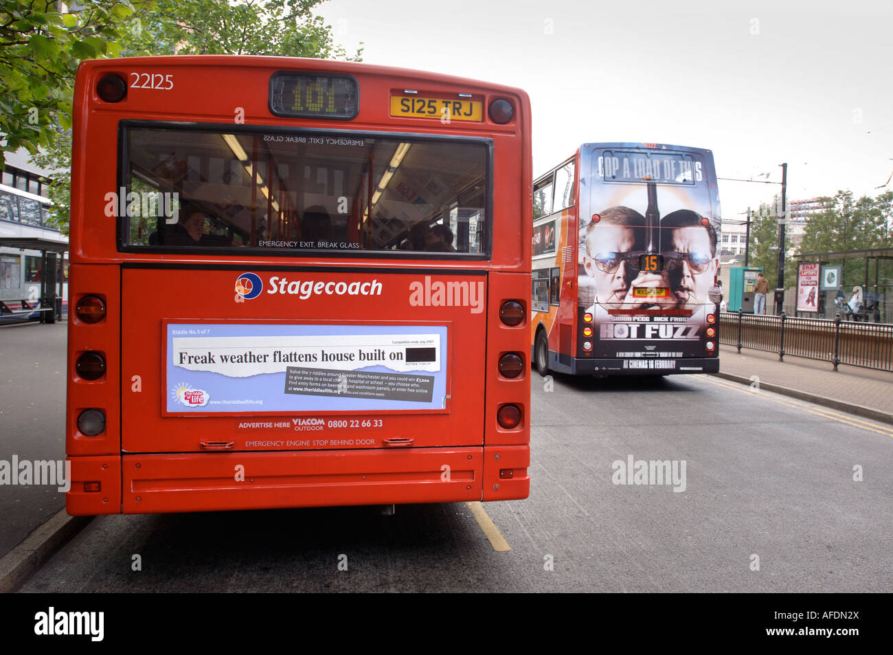 AN ADVERTISEMENT ON THE BACK OF A BUS WITH A CRYPTIC RELIGOUS MESSAGE ...