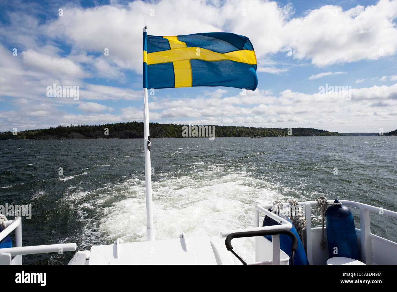 Boat with a swedish flag Stock Photo - Alamy