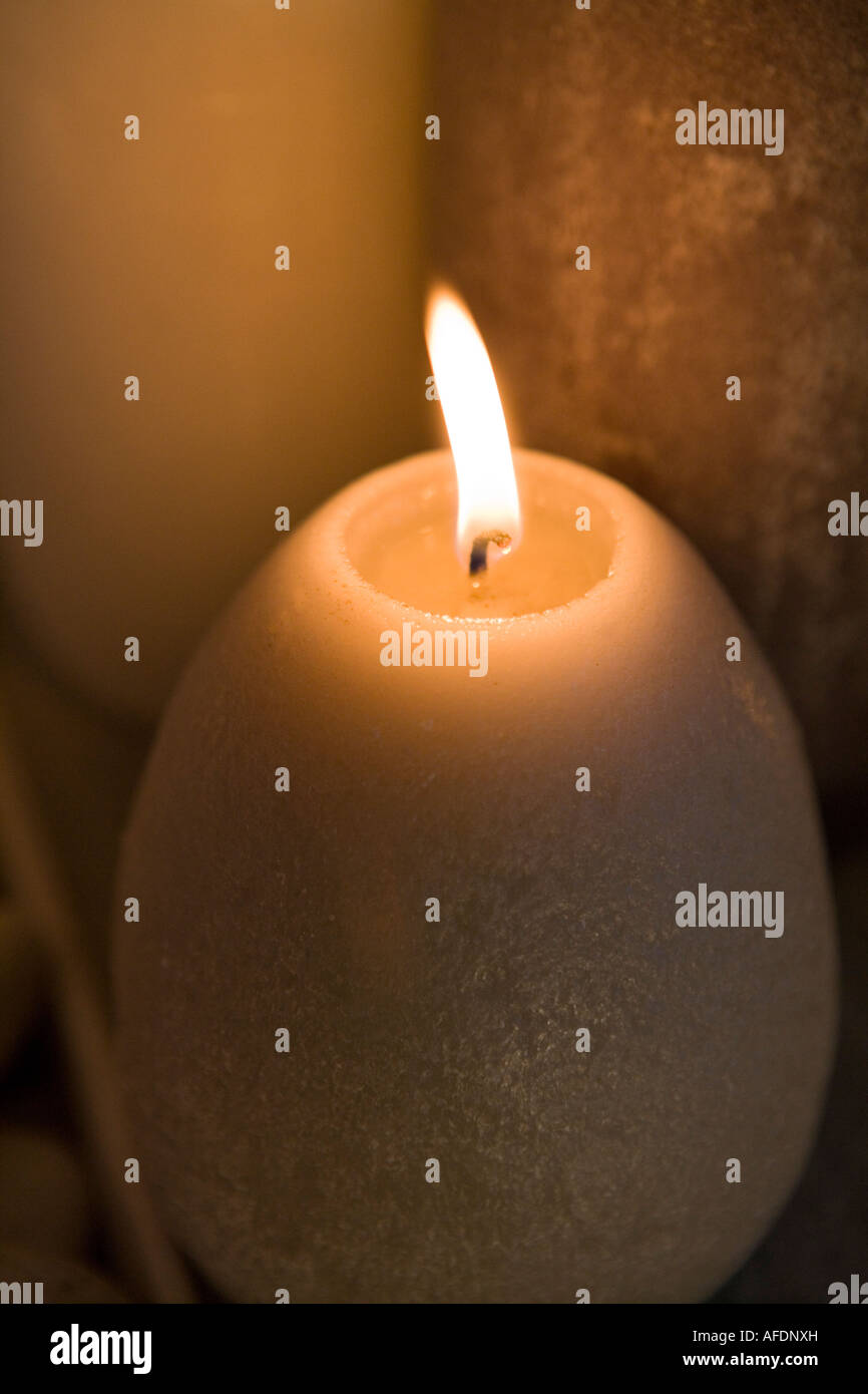 Close up shot of a burning wax candle Stock Photo - Alamy