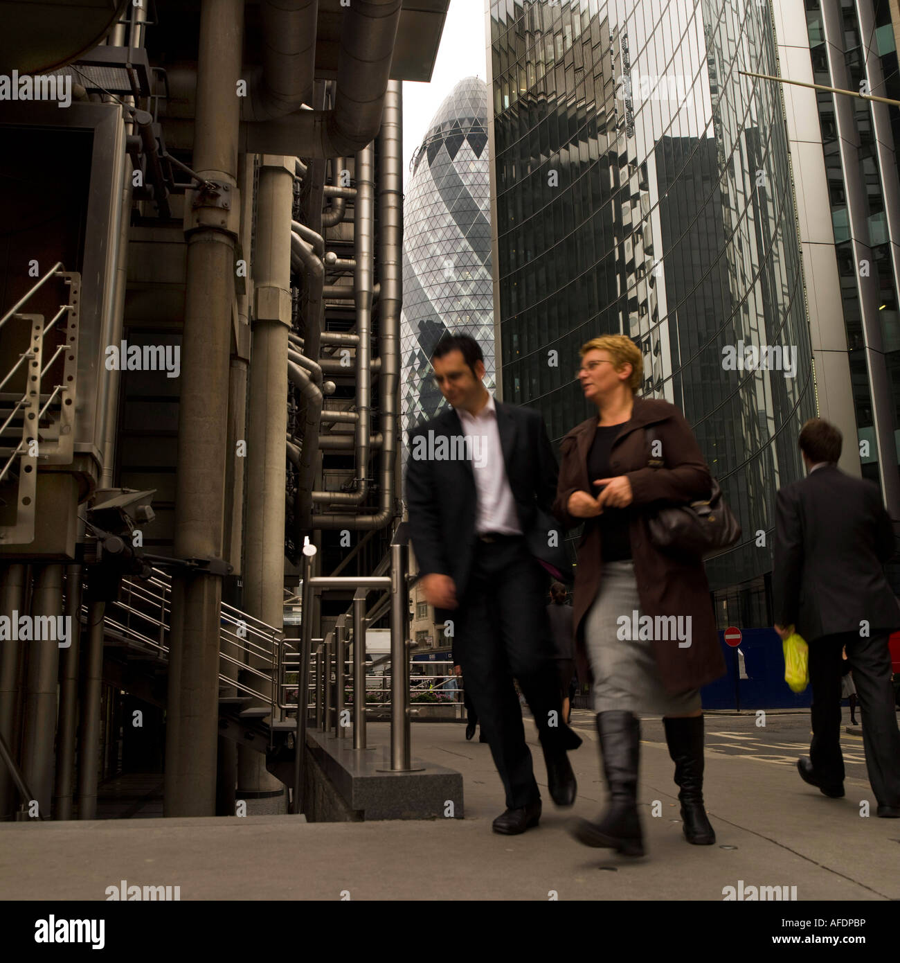 City workers outside Lloyds London England UK gray monochromatic ...