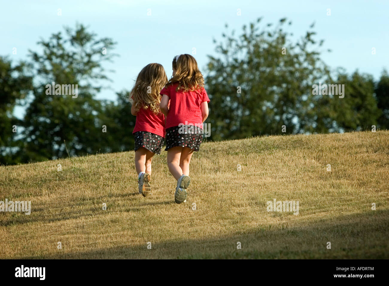Two Girls Running Together Stock Photo - Alamy Two Girls Running Together Stock Photo - Alamy