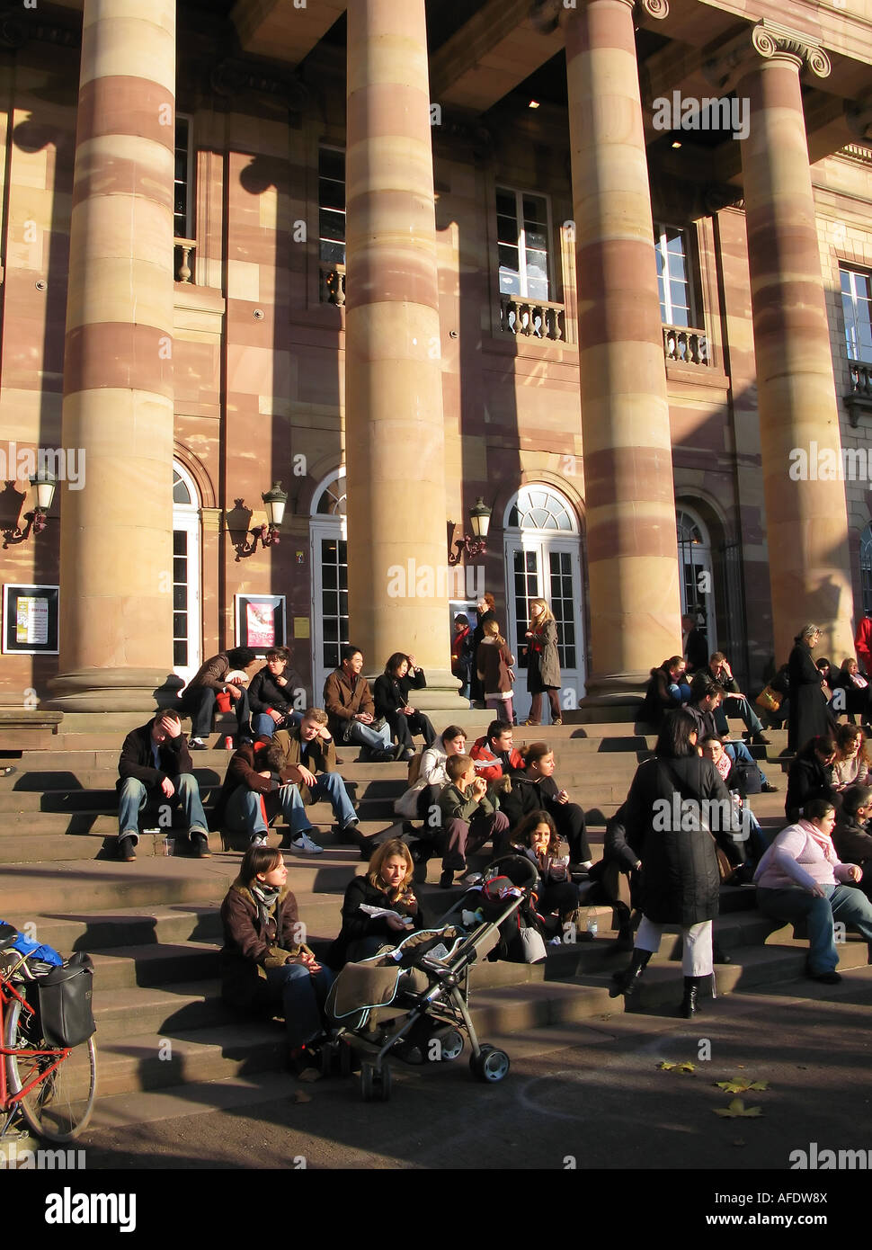 People sitting on Opera house steps, Strasbourg, Alsace, France Stock ...