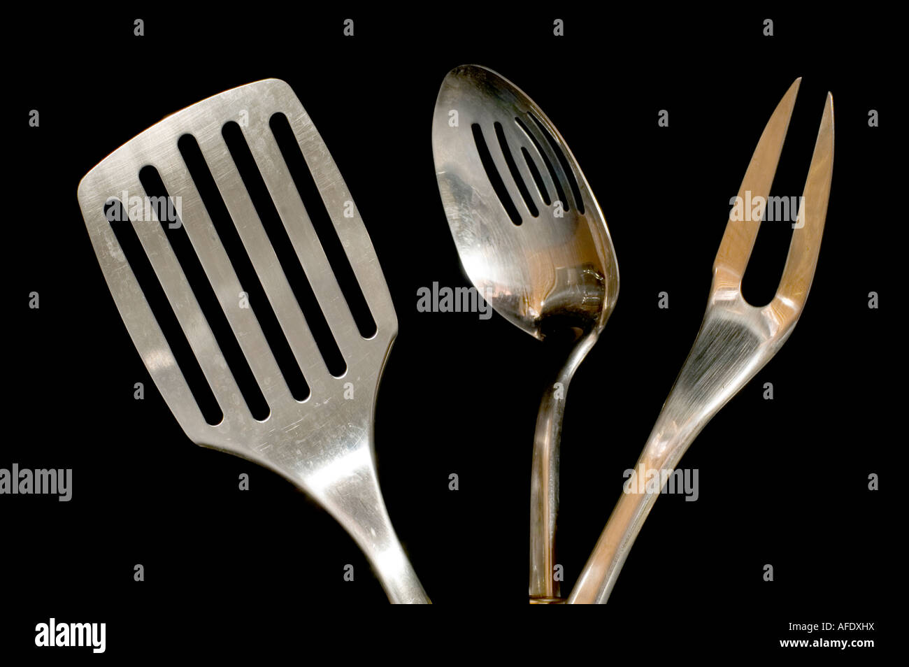 series object on black kitchen utensil Stock Photo - Alamy