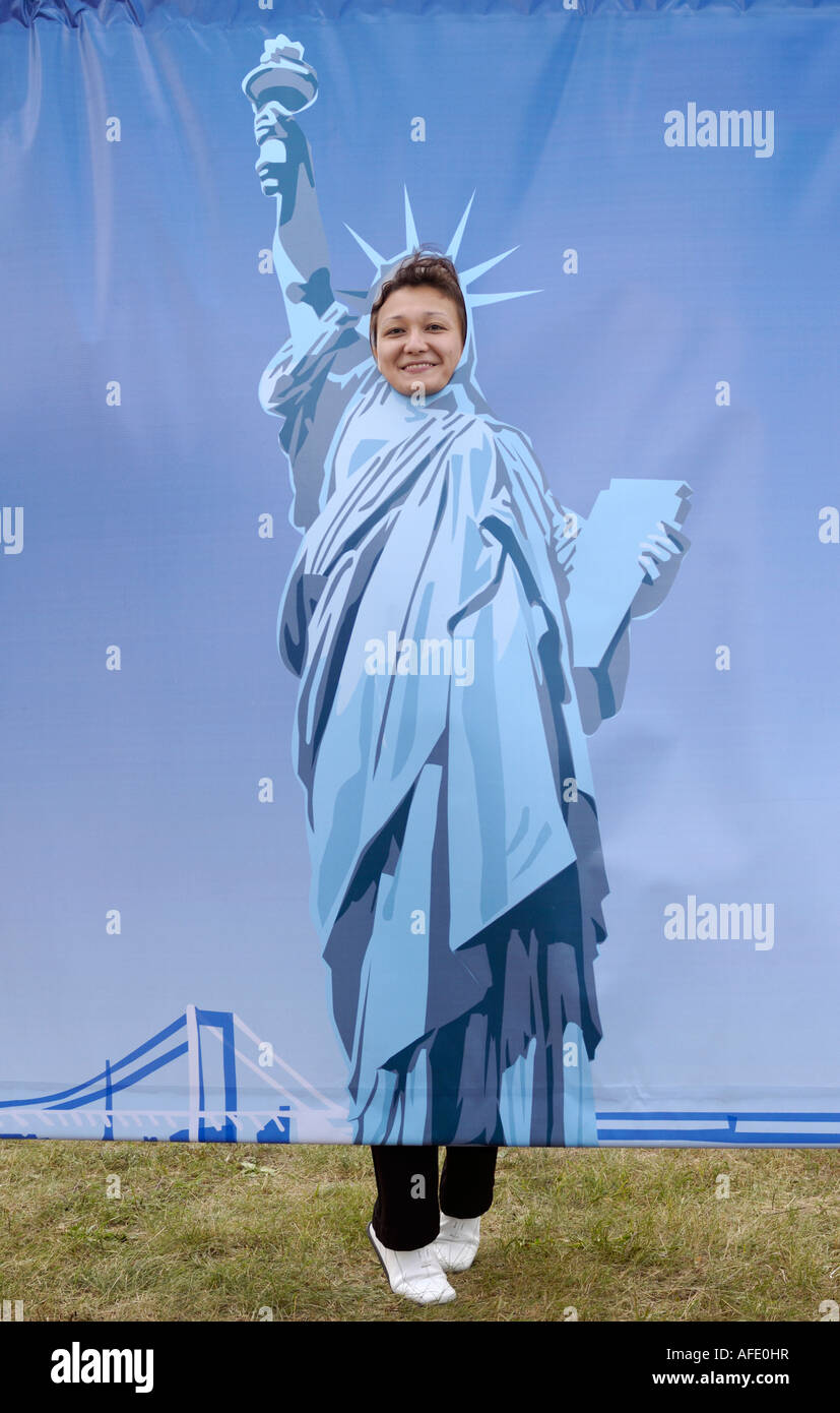 Happy ethnic woman posing in painted Statue of Liberty posing photo ...