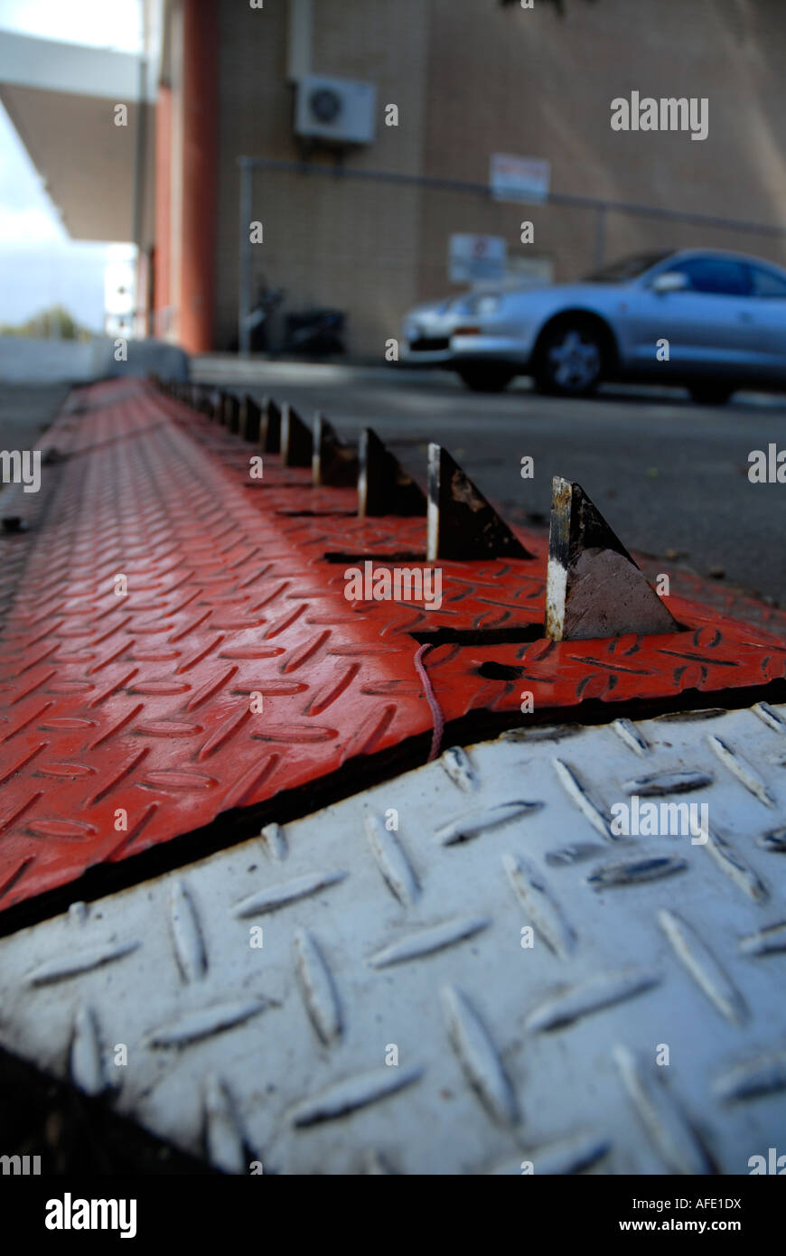 traffic control barrier with metal spikes Stock Photo - Alamy