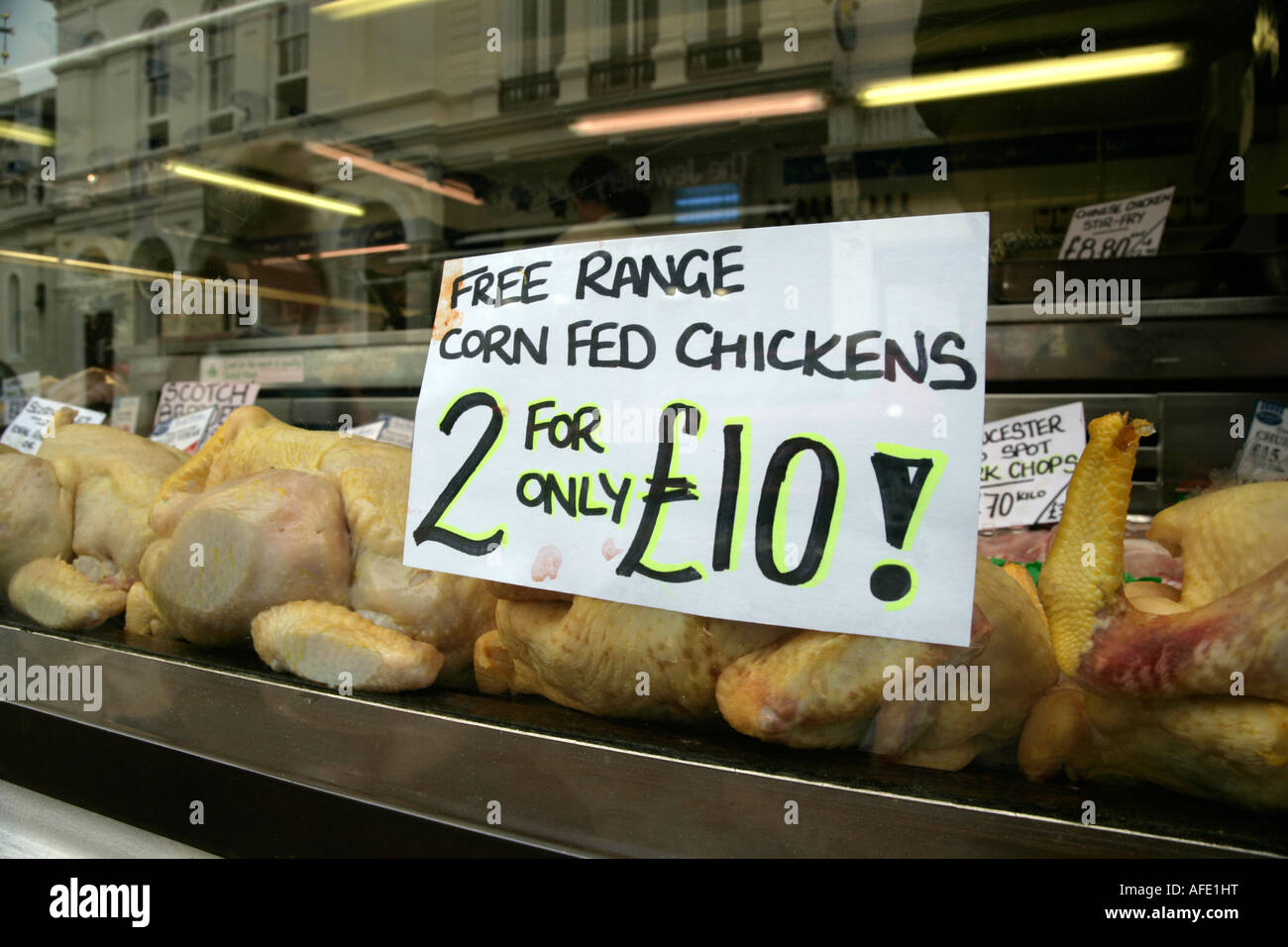 Free range corn fed chickens for sale on display in butcher's shop ...