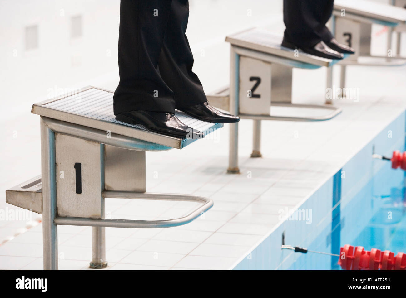 Businessmen on starting blocks Stock Photo - Alamy