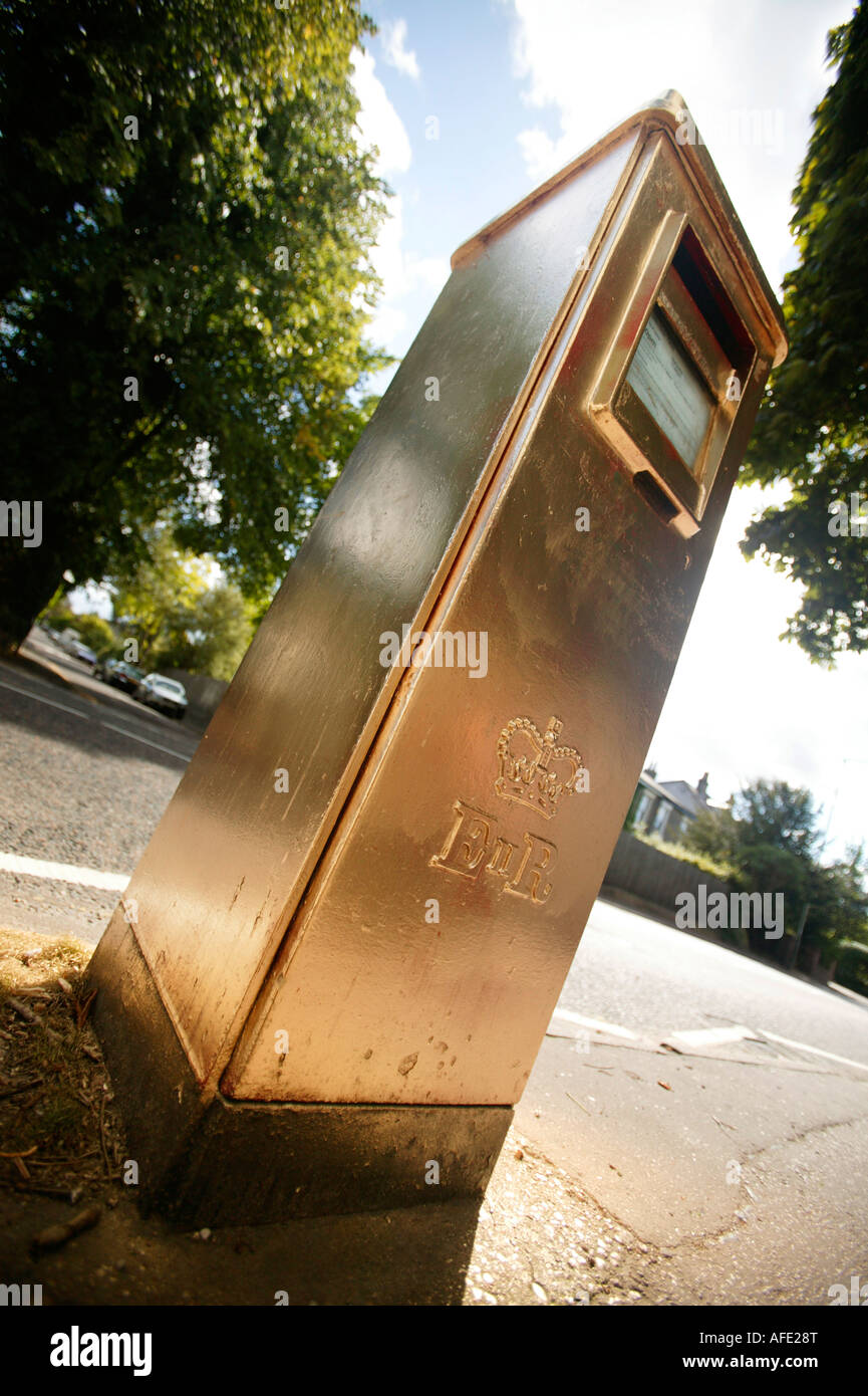 Post Box Painted Gold, Norwich, UK Stock Photo - Alamy