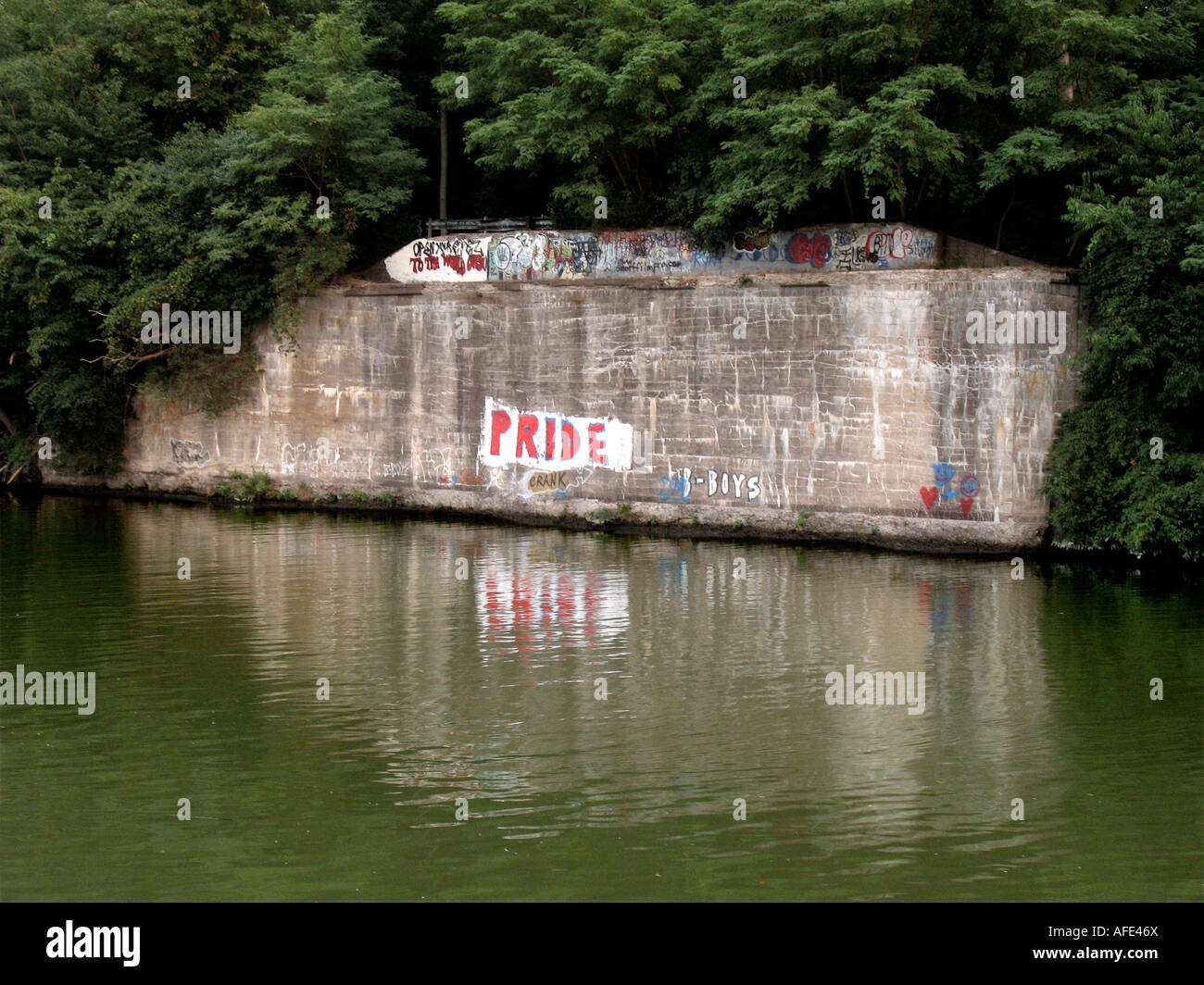 Remains of old bridge with graffiti Stock Photo - Alamy