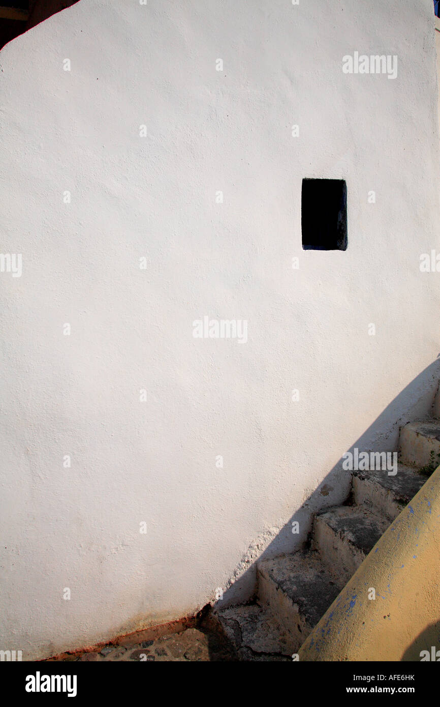 small square window in whitewashed wall Stock Photo - Alamy