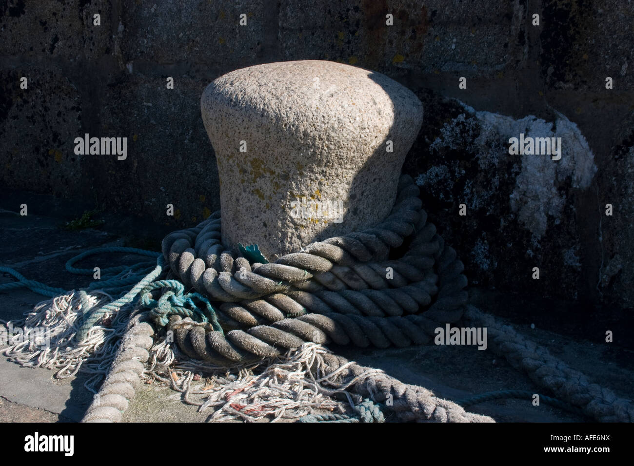 Stone mooring bollard at Charlestwon Cornwall Stock Photo - Alamy