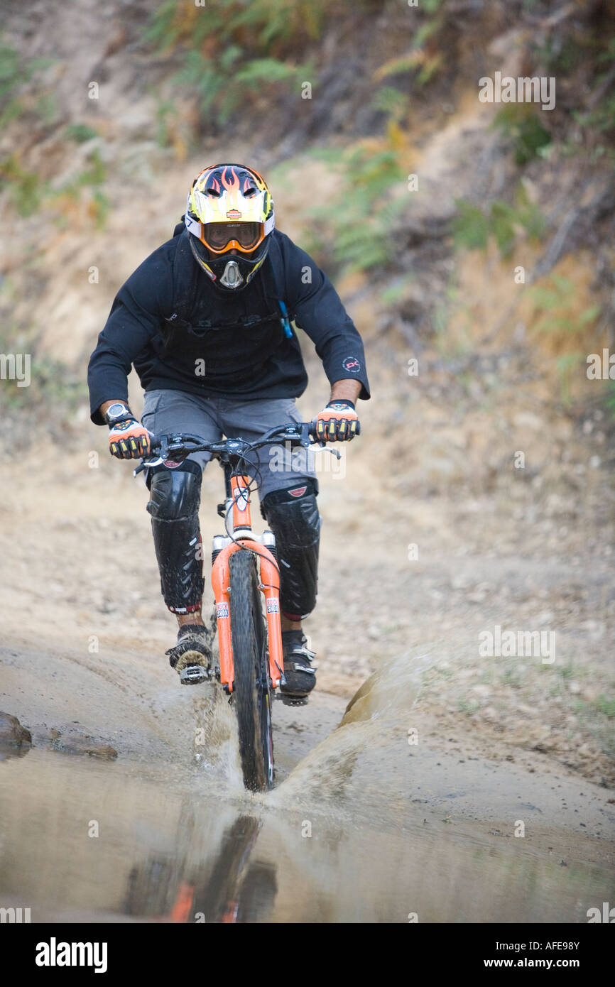 Mountain Biker crossing a stream Stock Photo - Alamy