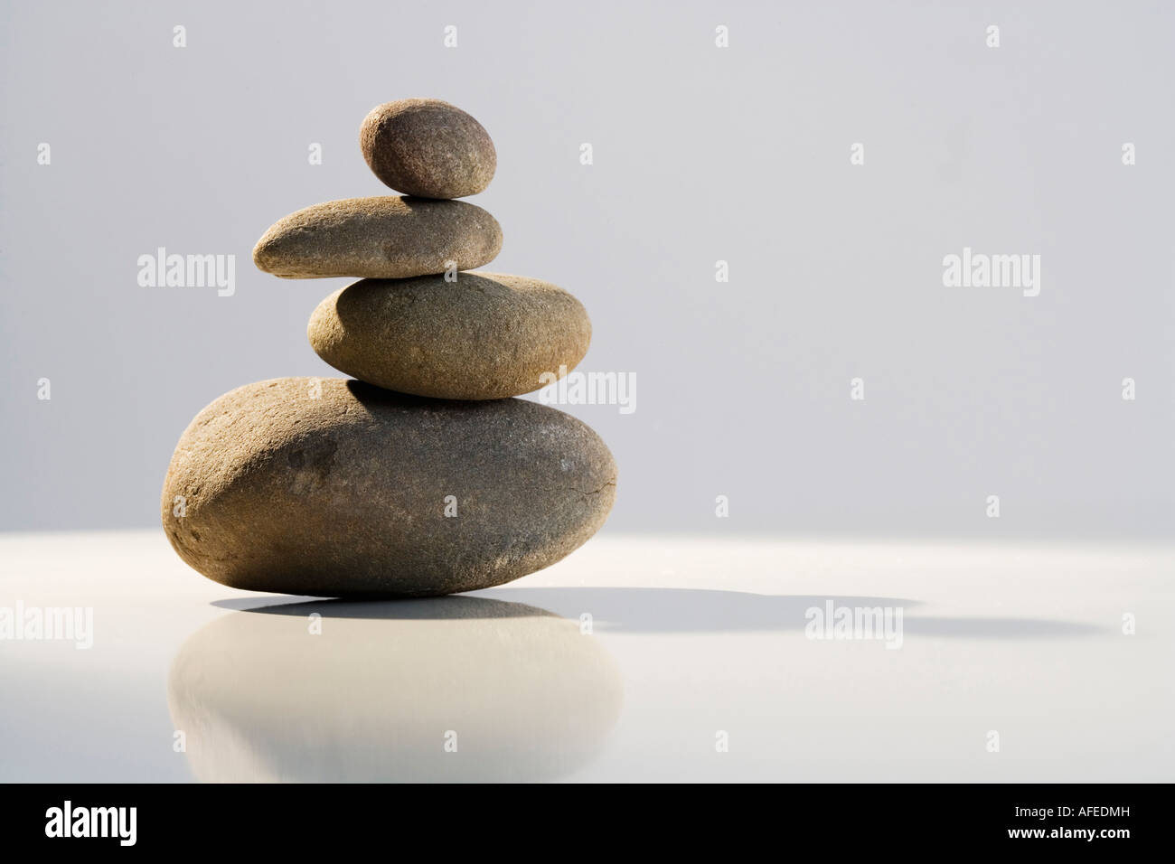 Stack of balanced stones in Zen like setting Stock Photo - Alamy