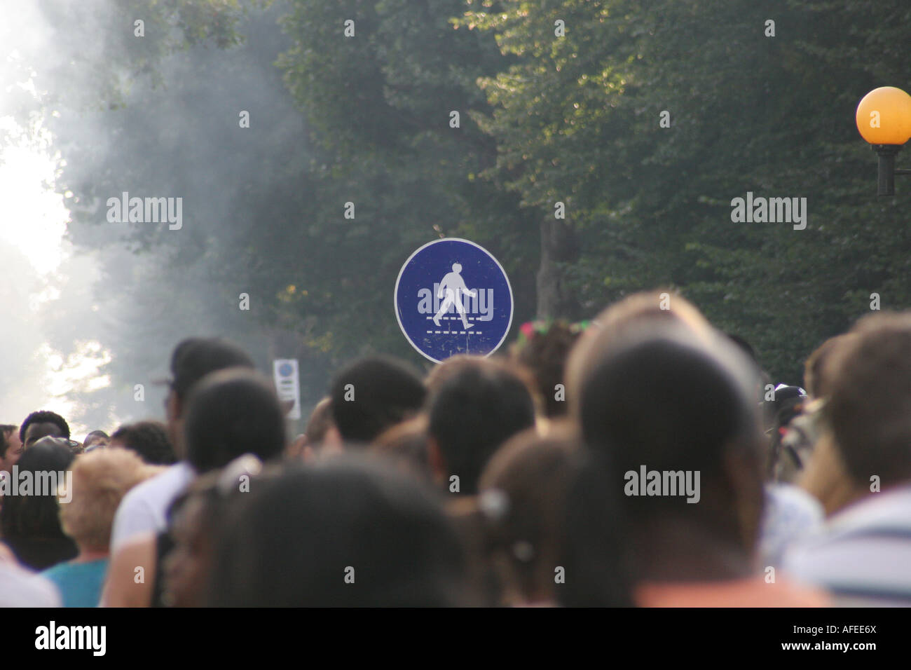Walking sign sticking out in the crowds Stock Photo - Alamy