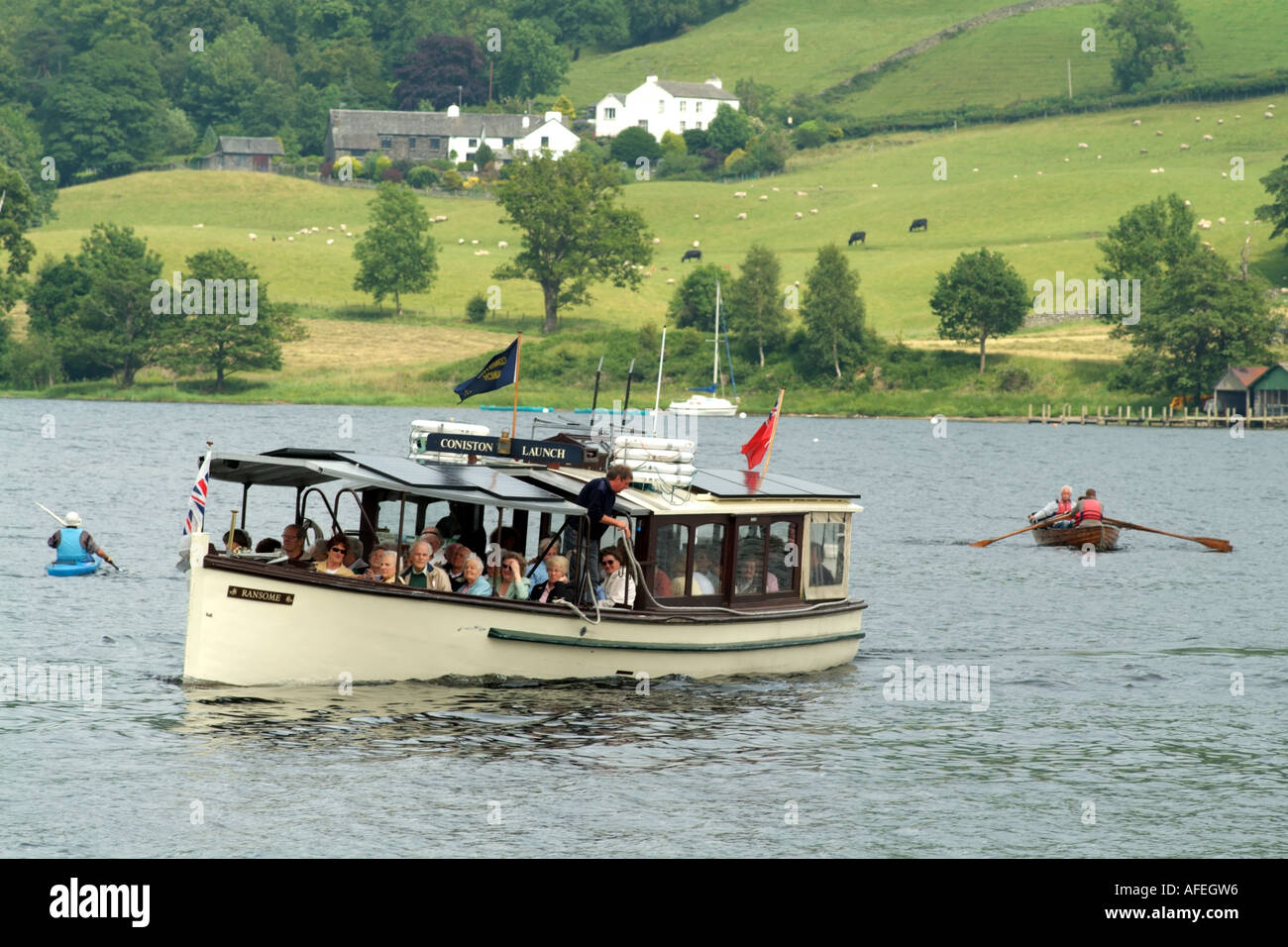Solar electric launch on Coniston Water. Lake District Cumbria northern ...