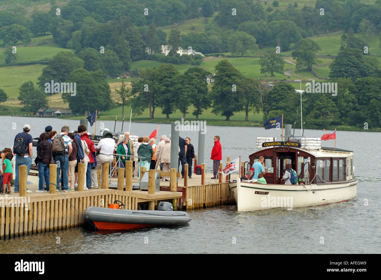 Solar electric launch on Coniston Water. Lake District Cumbria northern ...