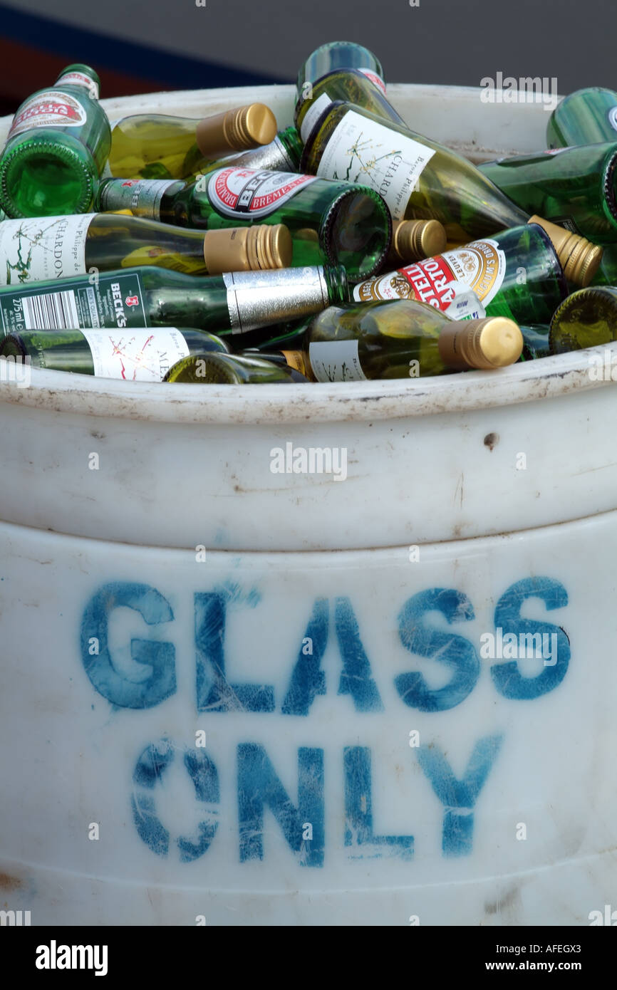 Glass bottles for recycling in a glass only plastic bin Stock Photo - Alamy