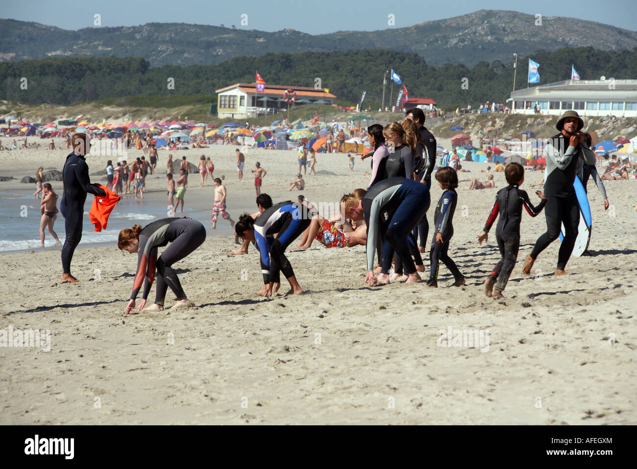Children in Surf school doing exercises on Afife Beach, Minho, Northern ...