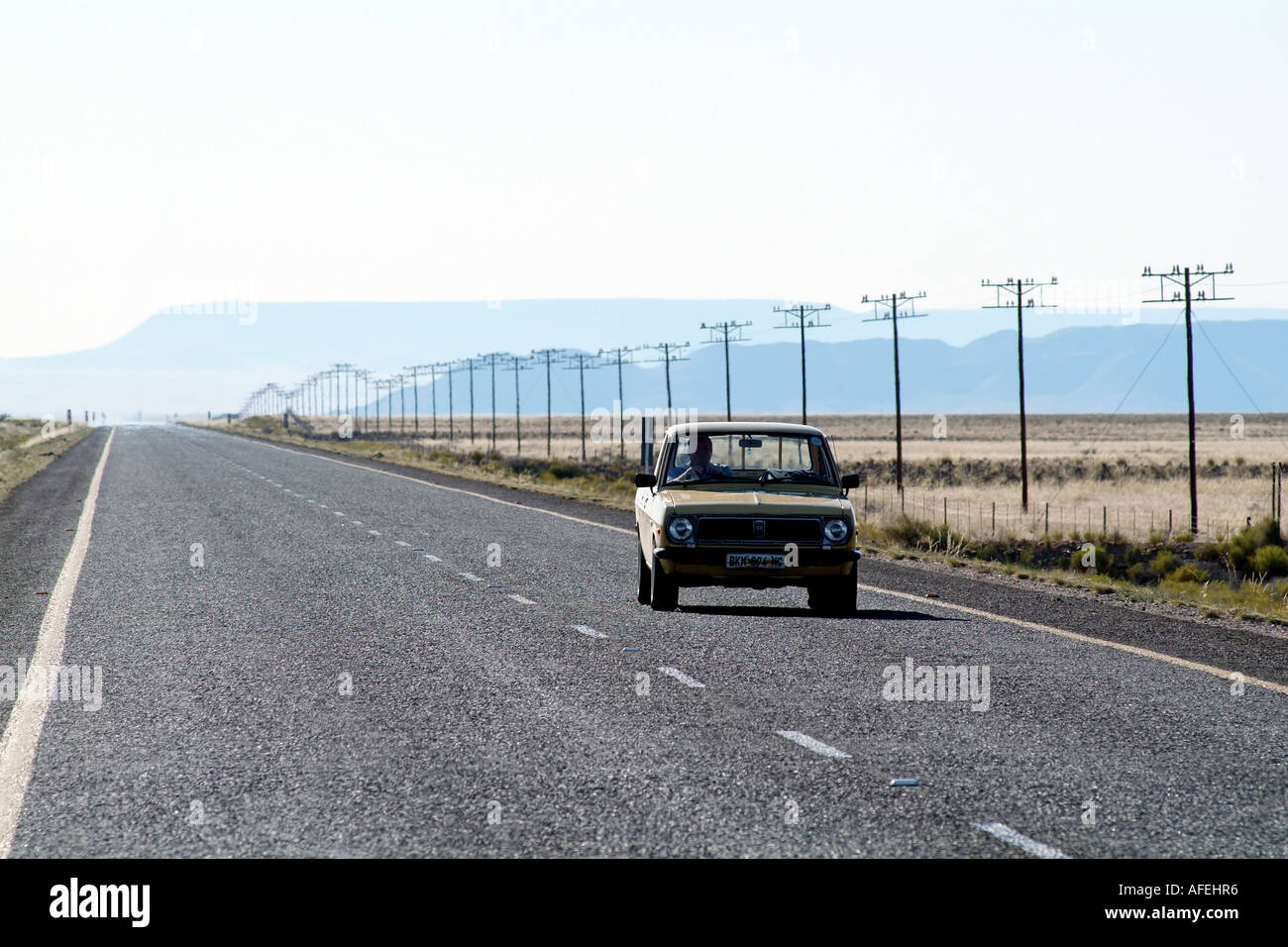 Driving in the Northern Cape South Africa RSA. Car on long straight ...