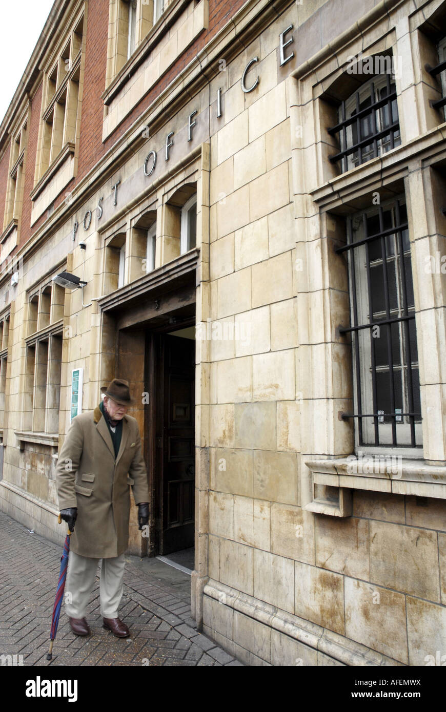 Old man outside post office Stock Photo - Alamy