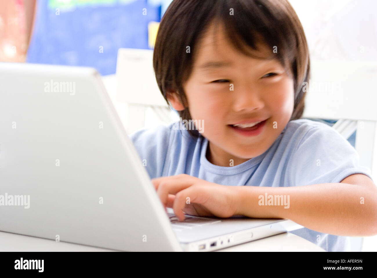 Young Boy on a Laptop Computer Stock Photo - Alamy
