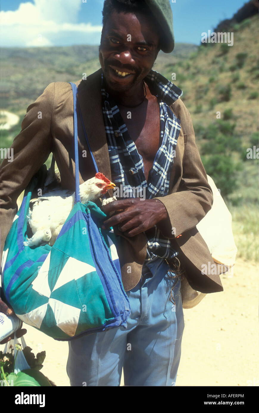 Man on his way to sell a hen in the market, Namibia Stock Photo - Alamy
