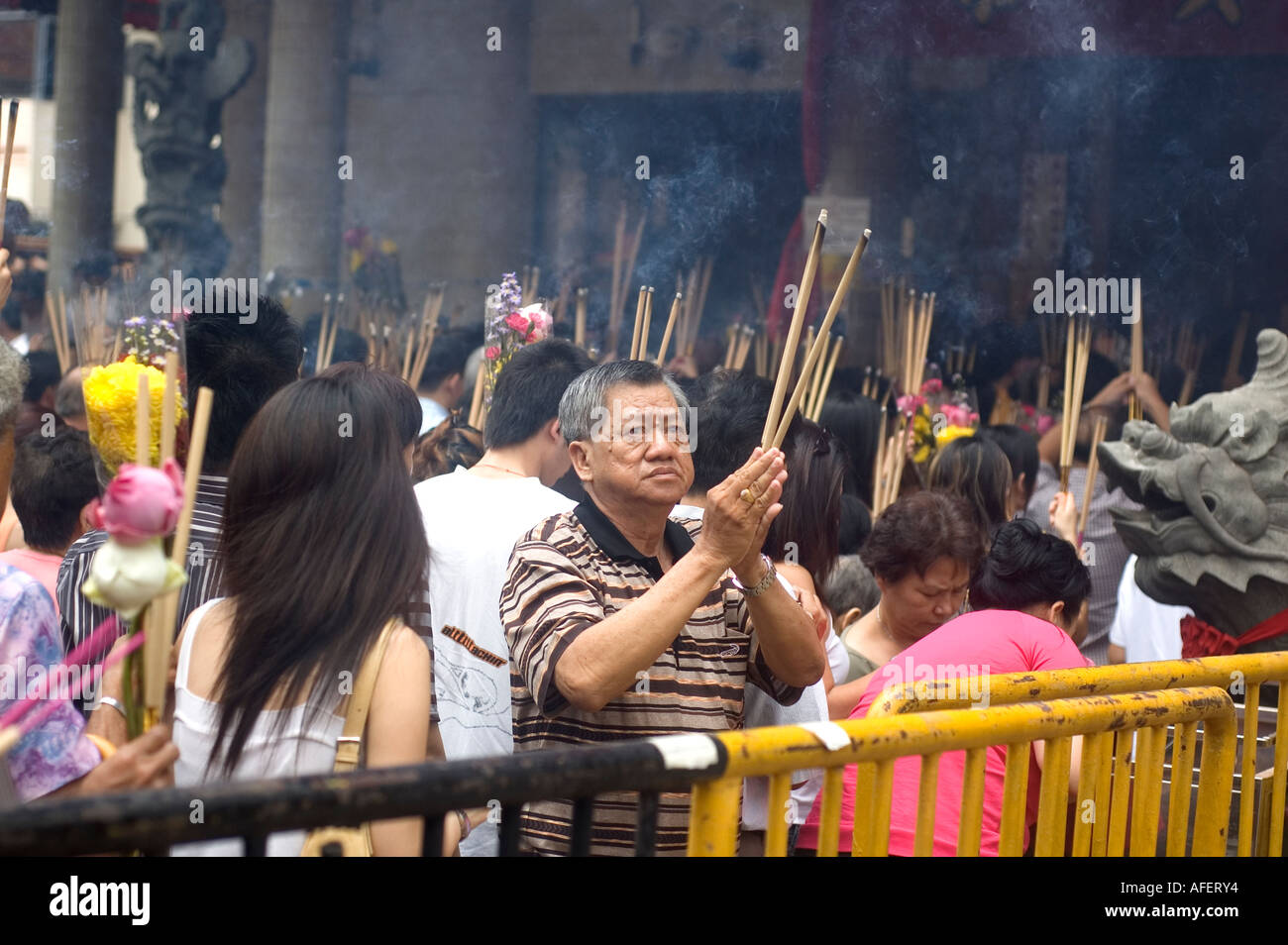 Chinese man praying at goddess mercy hi-res stock photography and ...