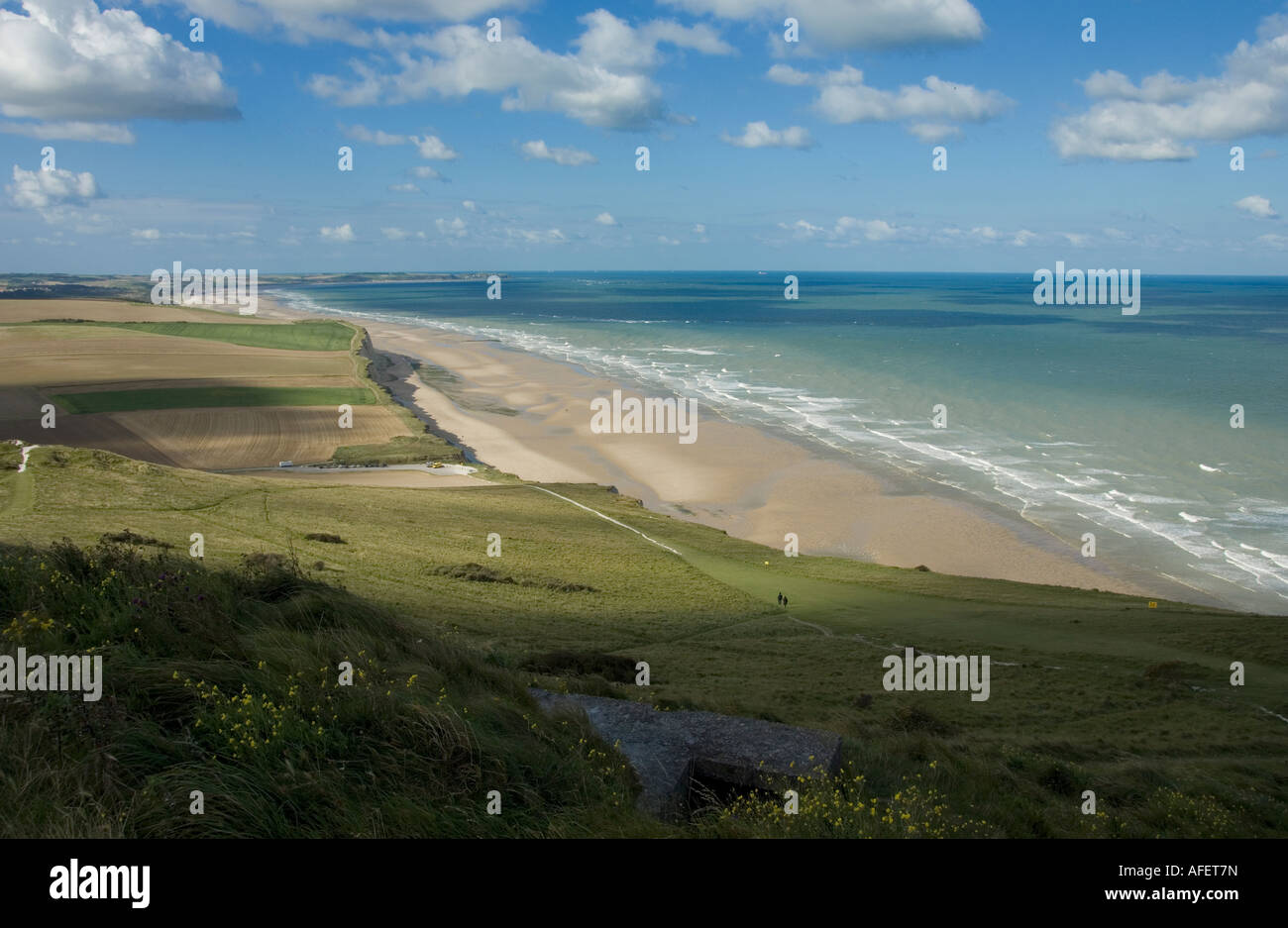 coastline near Calais with two figures walking on coastal path with ...