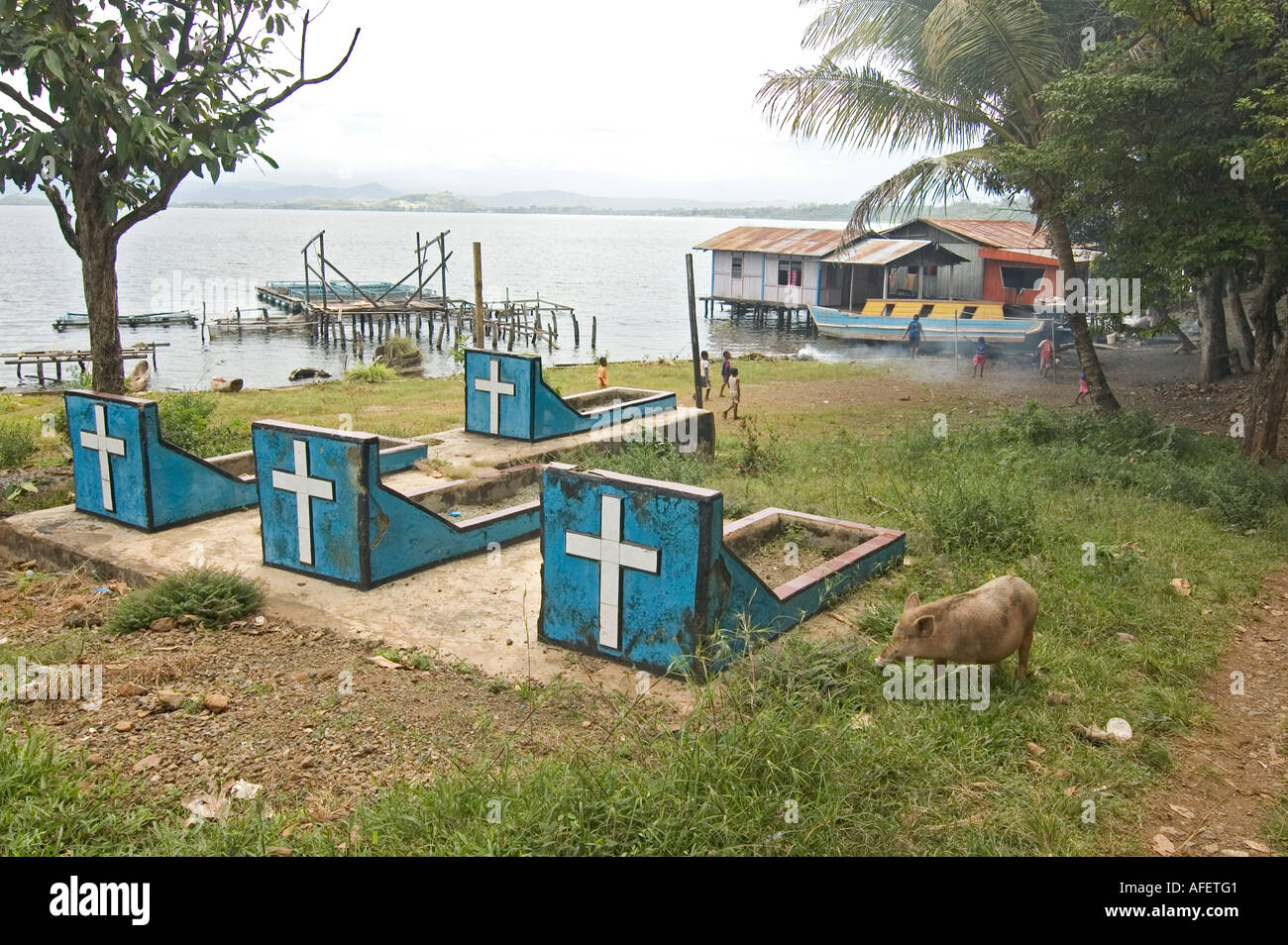 Christian graves, marked with a cross, in a Papuan village on the ...