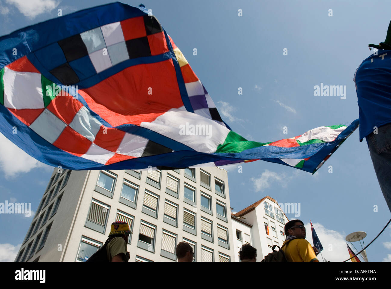 An Italian fan waving a giant flag at passing Australian supporters in ...