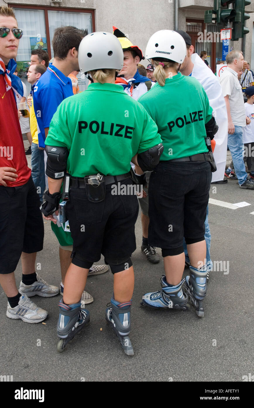 Female German Police officers on roller skates Stock Photo - Alamy
