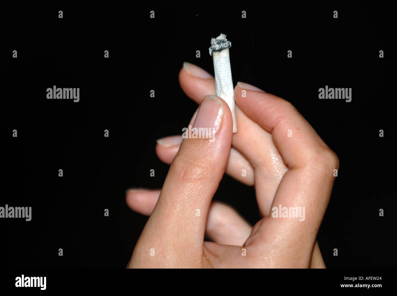 Cigarette in hand Stock Photo - Alamy