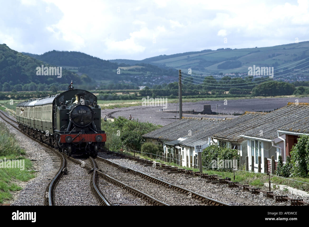 STEAM TRAIN APPROACHING BLUE ANCHOR STATION FROM MINEHEAD SOMERSET STEAM RAILWAY ENGLAND Stock ...