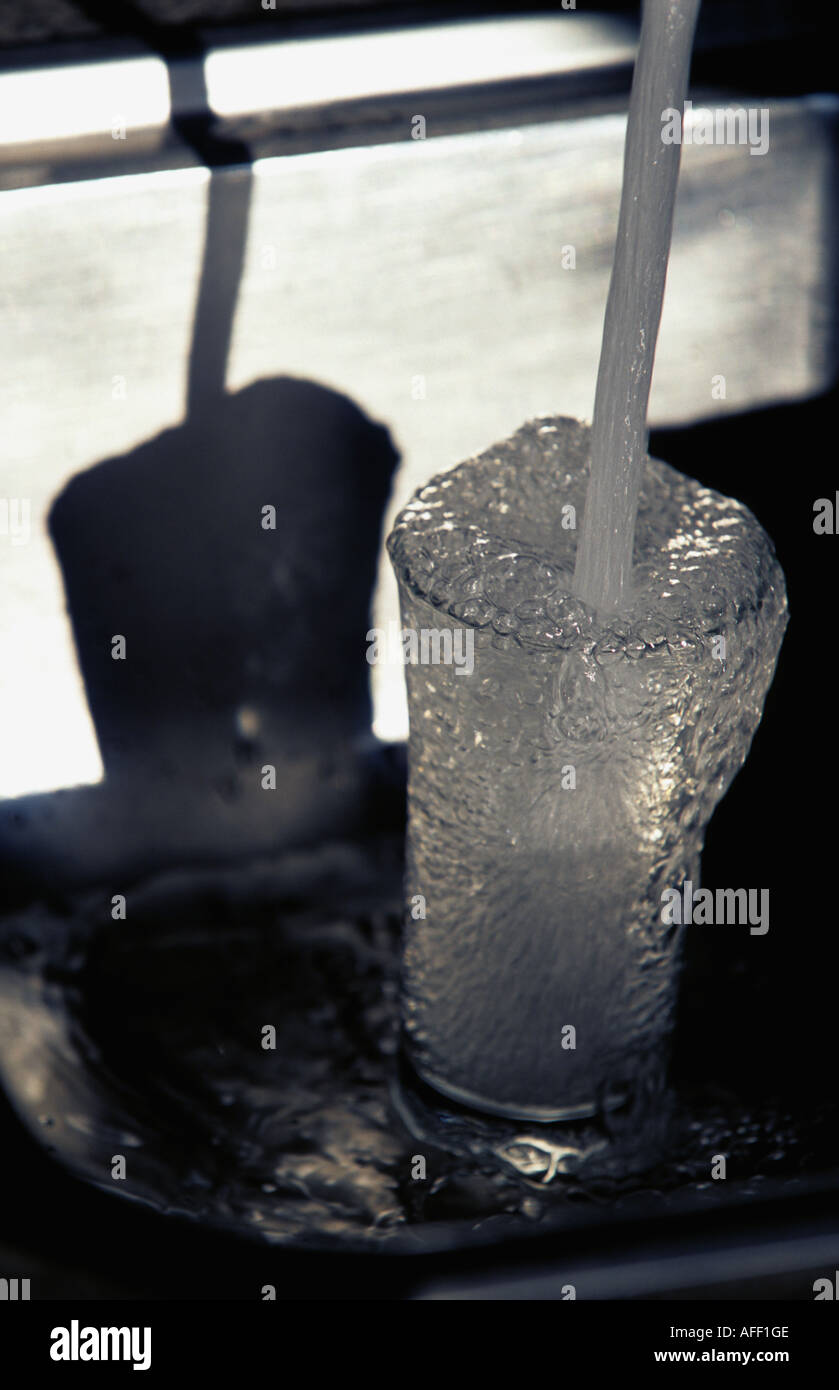 Glass overflowing with tap water supplied to a home in Suffolk from ...