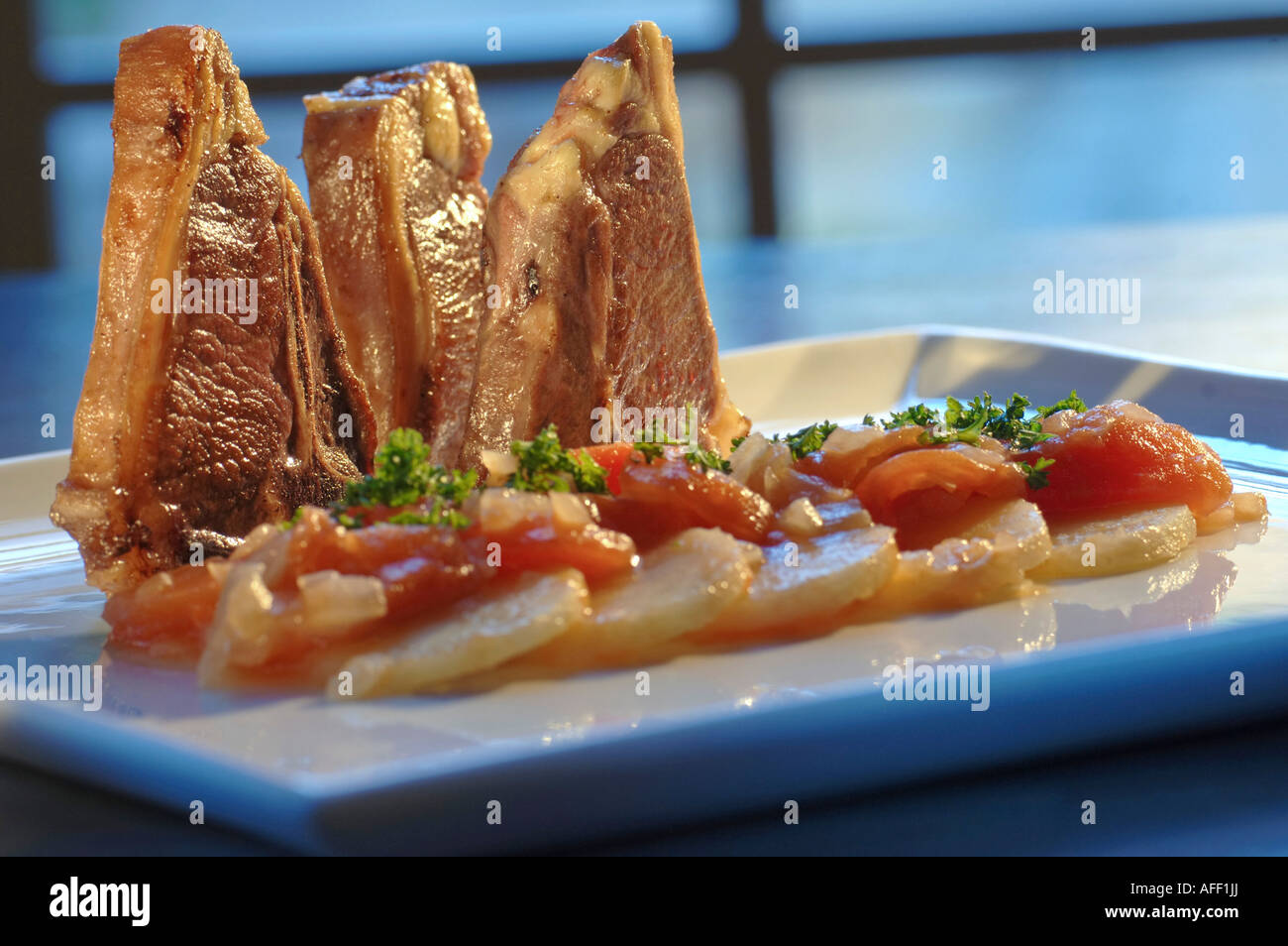 Lamb chops and smoked salmon Stock Photo - Alamy
