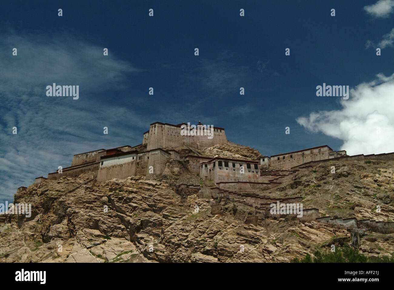 A monastery perched on a mountain top in Tibet, on the road from Lhatse ...