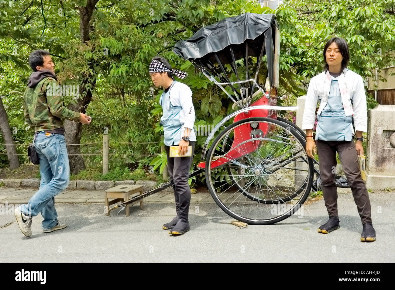 Japanese drivers of Rickshaw with a male customer, Kyoto, Japan Stock ...