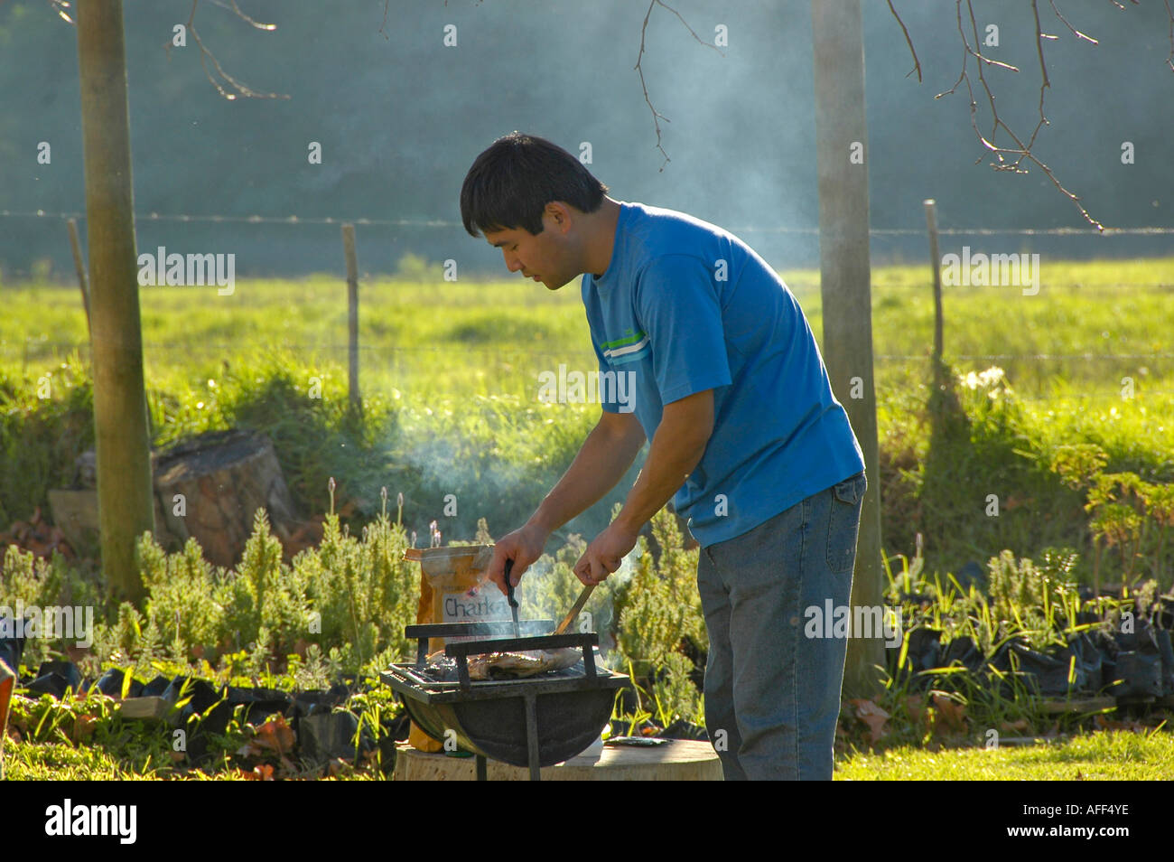 A Chinese language student enjoys the warmth of a braai barbecue in ...
