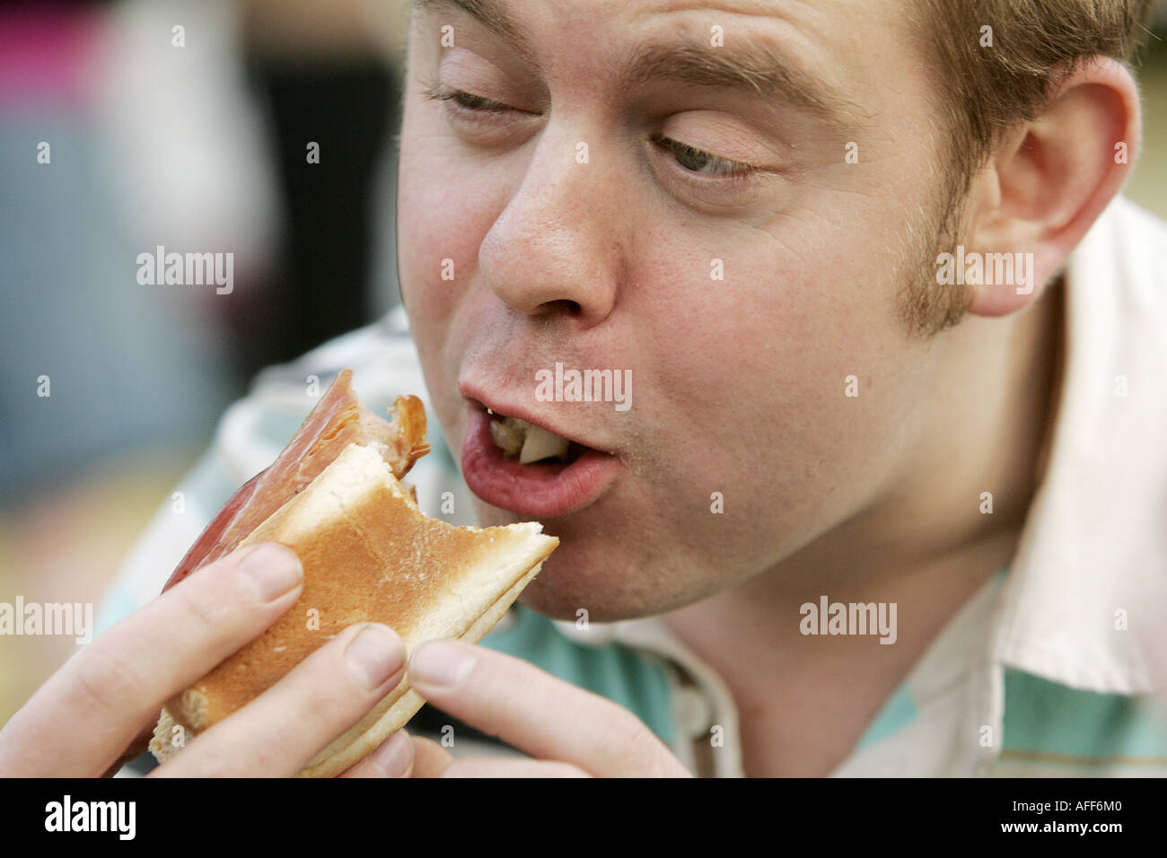 Young man eats junk food hi-res stock photography and images - Alamy